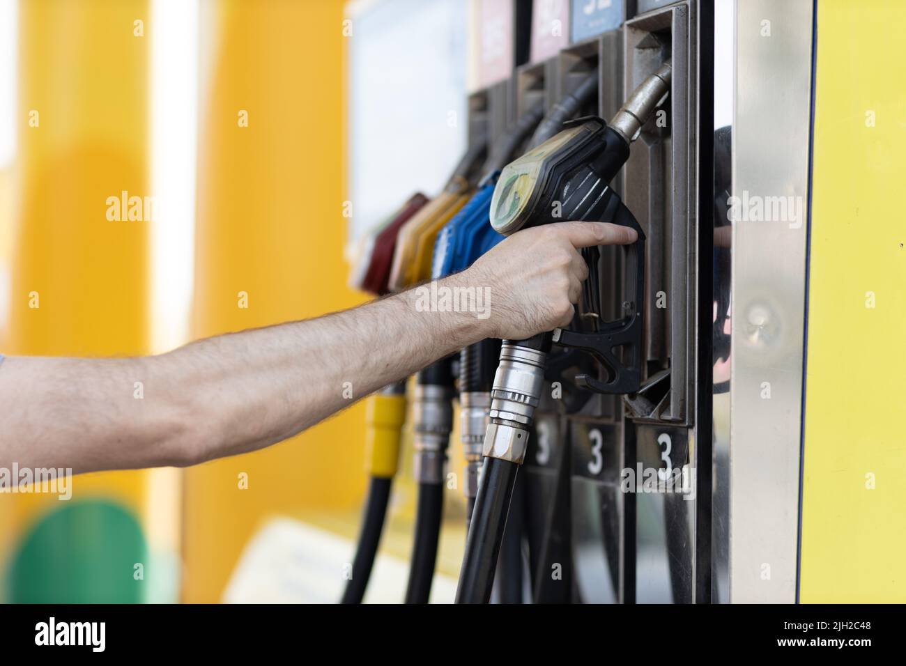 Sanctions economy crisis. Male hand holding filling gun in his hand at ...