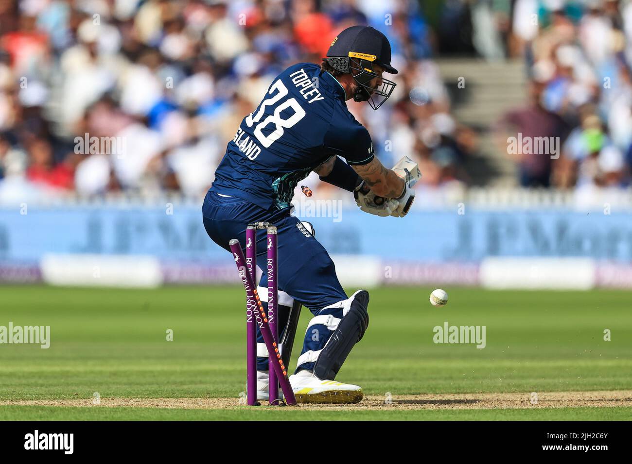 Reece Topley of England is bowled by Jasprit Bumrah of India Stock ...