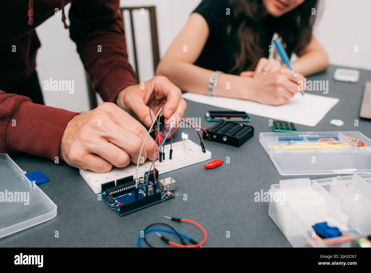 Engineers assembling electronic construction Stock Photo - Alamy