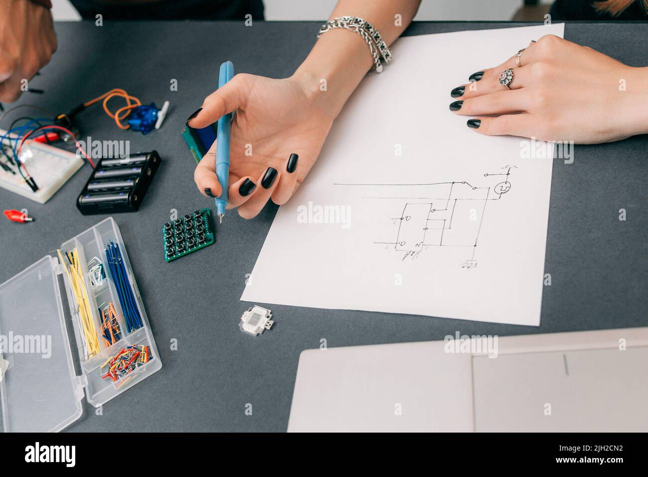 Engineer drawing scheme of electronic construction Stock Photo - Alamy