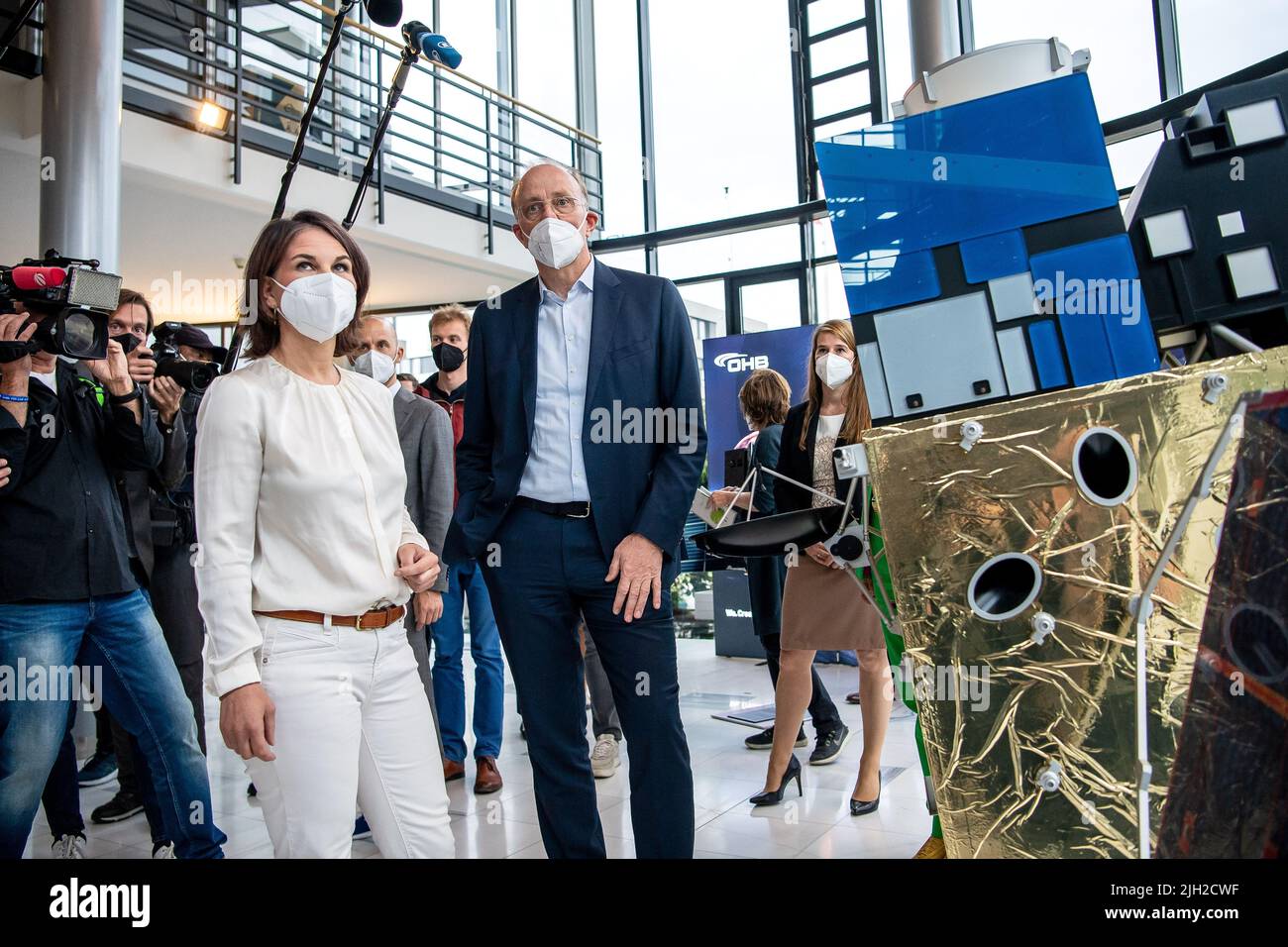 Bremen, Germany. 14th July, 2022. Marco Fuchs (r), CEO of OHB, explains ...