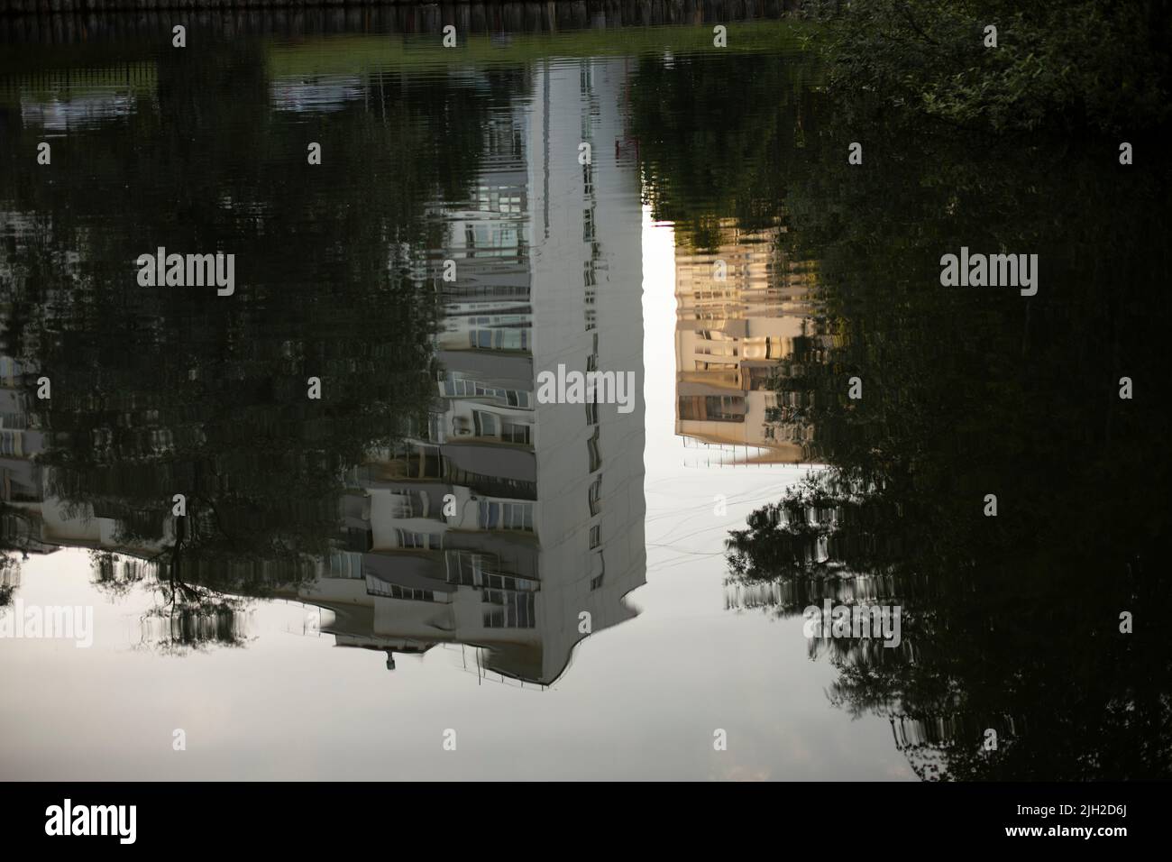Reflection in puddle. House is reflected in water Stock Photo - Alamy