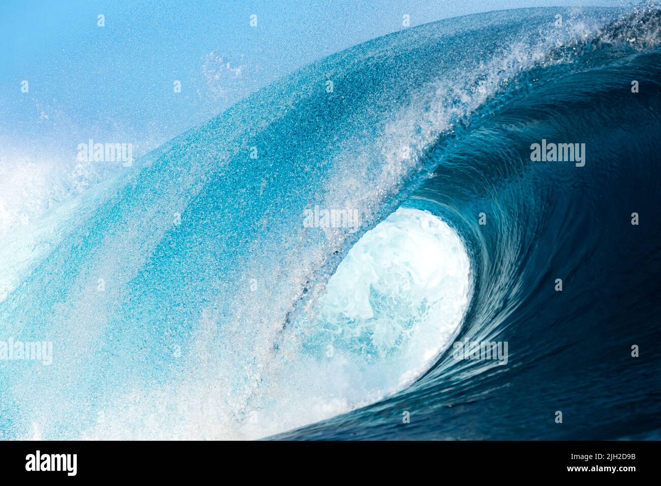 Powerful wave breaking on a beach with palm trees Stock Photo - Alamy