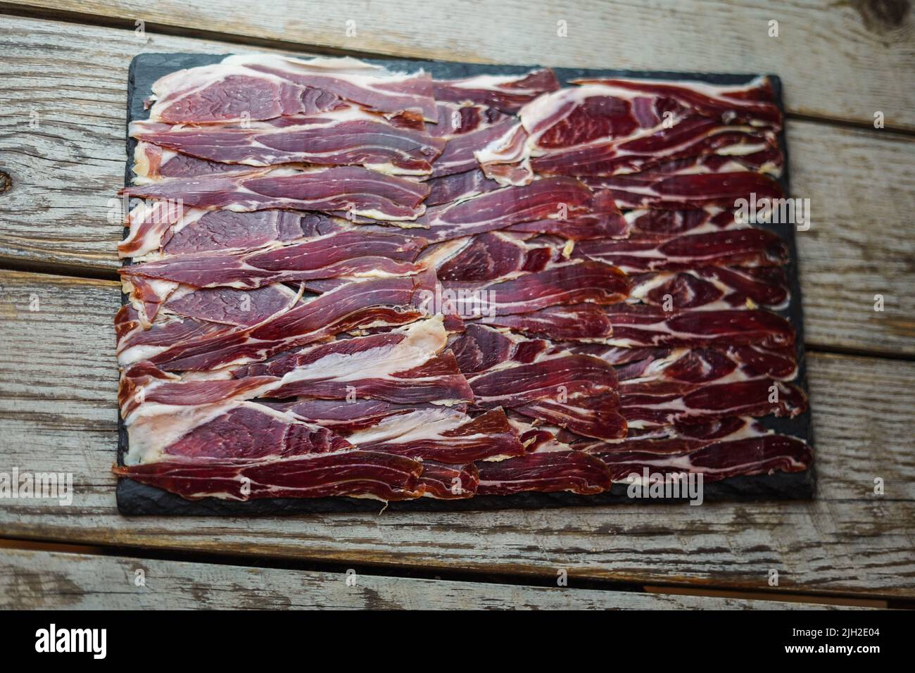 Spanish Iberian ham portion in a luxury European restaurant Stock Photo ...