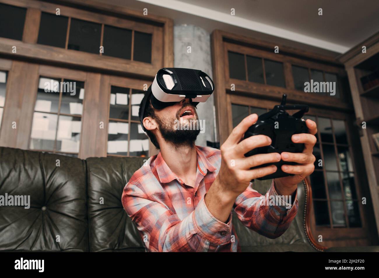 Man in vr glasses controlling something invisible Stock Photo - Alamy