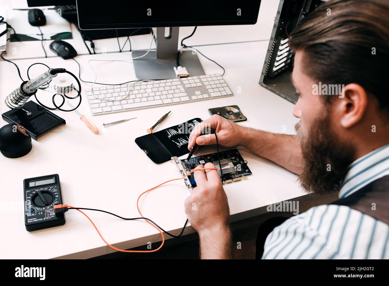 Bearded engineer testing microcircuit Stock Photo - Alamy