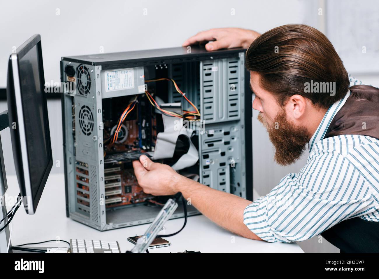 Engineer fixing circuit in disassembled CPU Stock Photo - Alamy