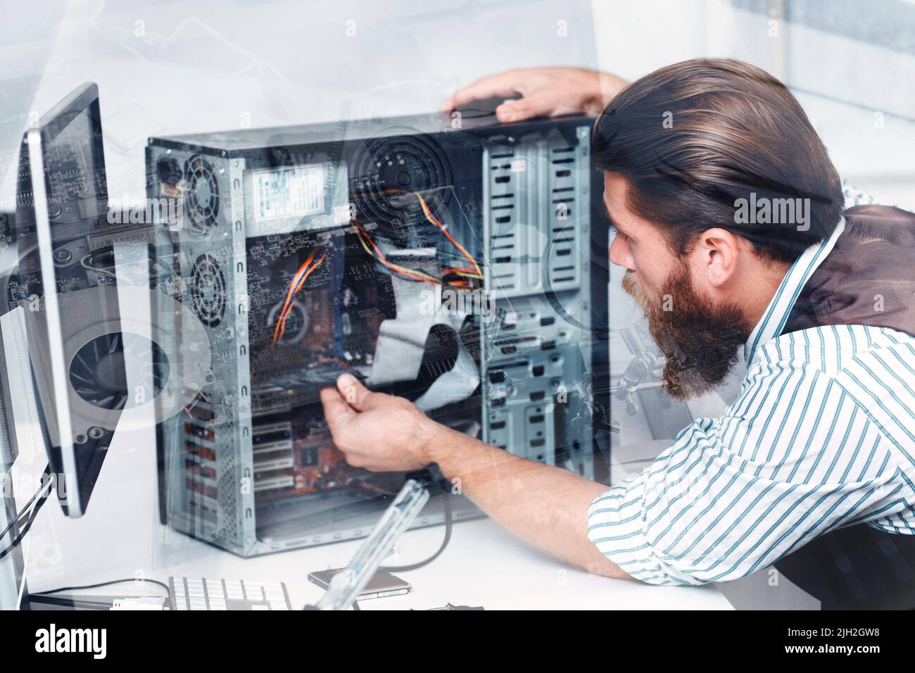 Engineer disassembling CPU, double exposure Stock Photo - Alamy