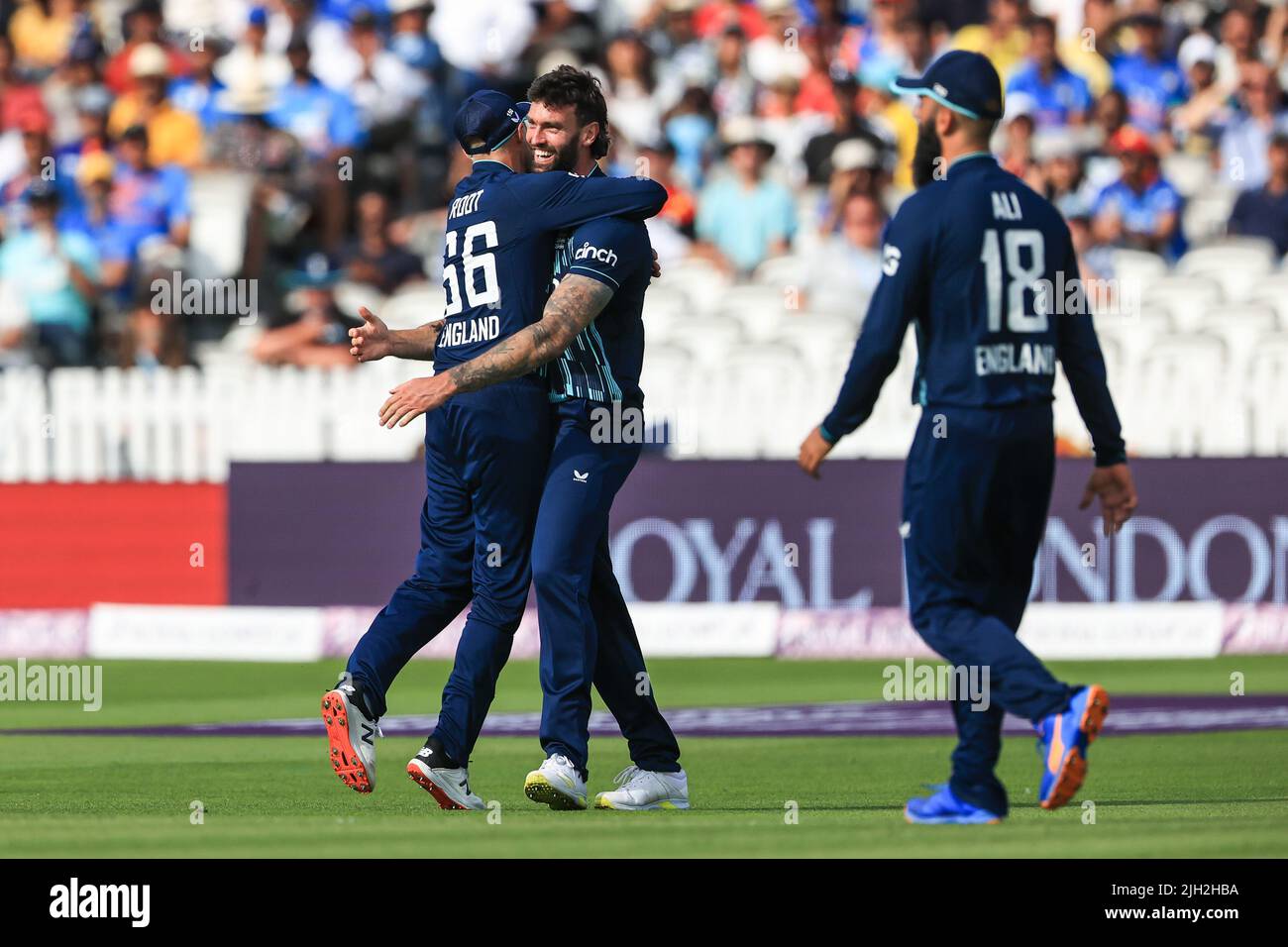 Reece Topley of England and Joe Root celebrate the wicket of Rohit ...