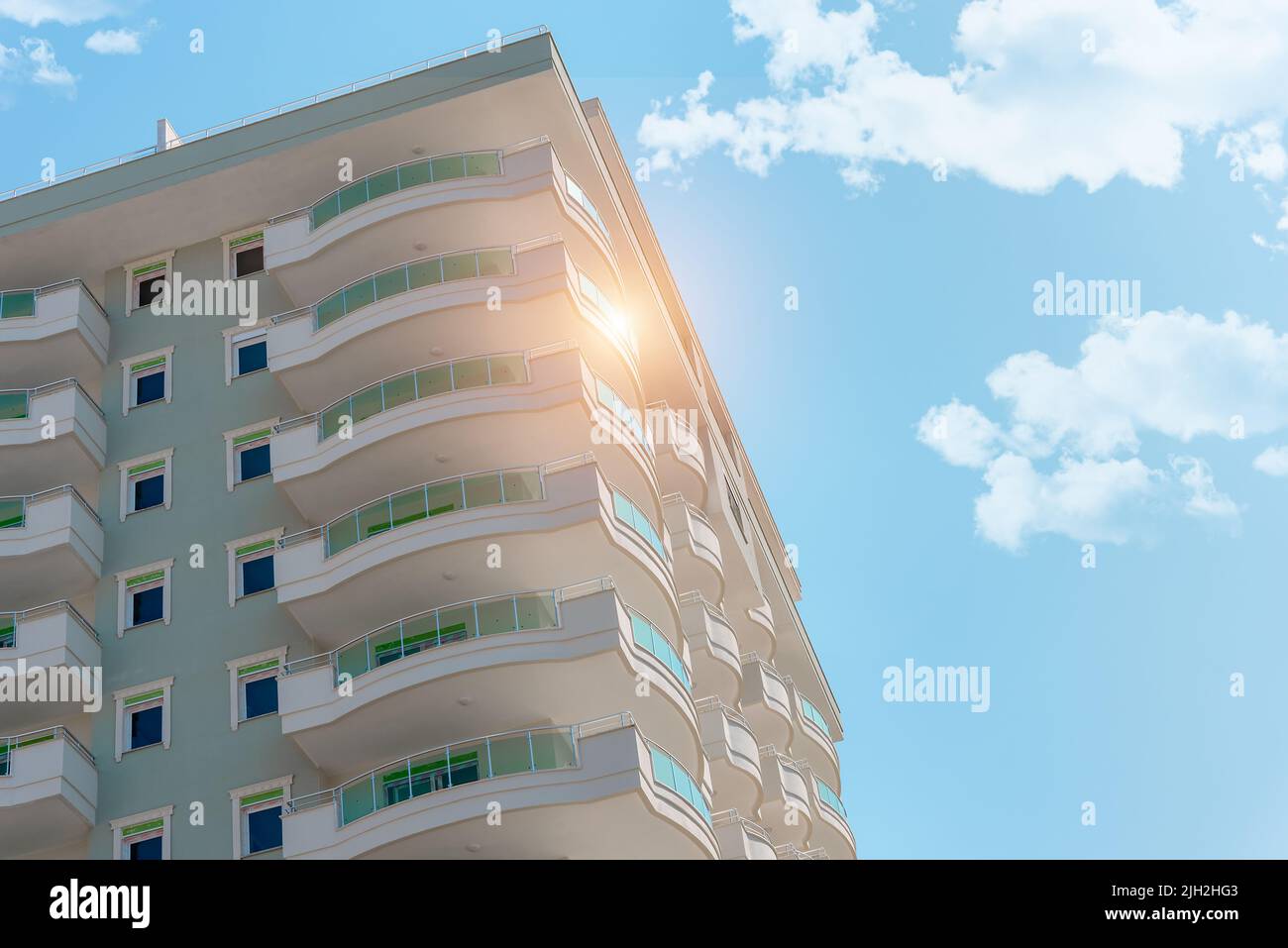 Corner of a residential block building against the sky. Modern Turkish ...