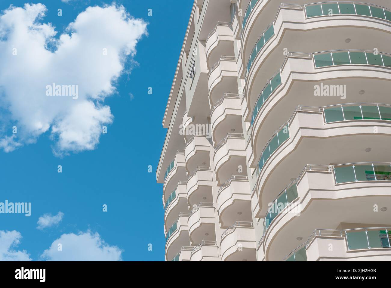 Corner of a residential block building against the sky. Modern Turkish ...