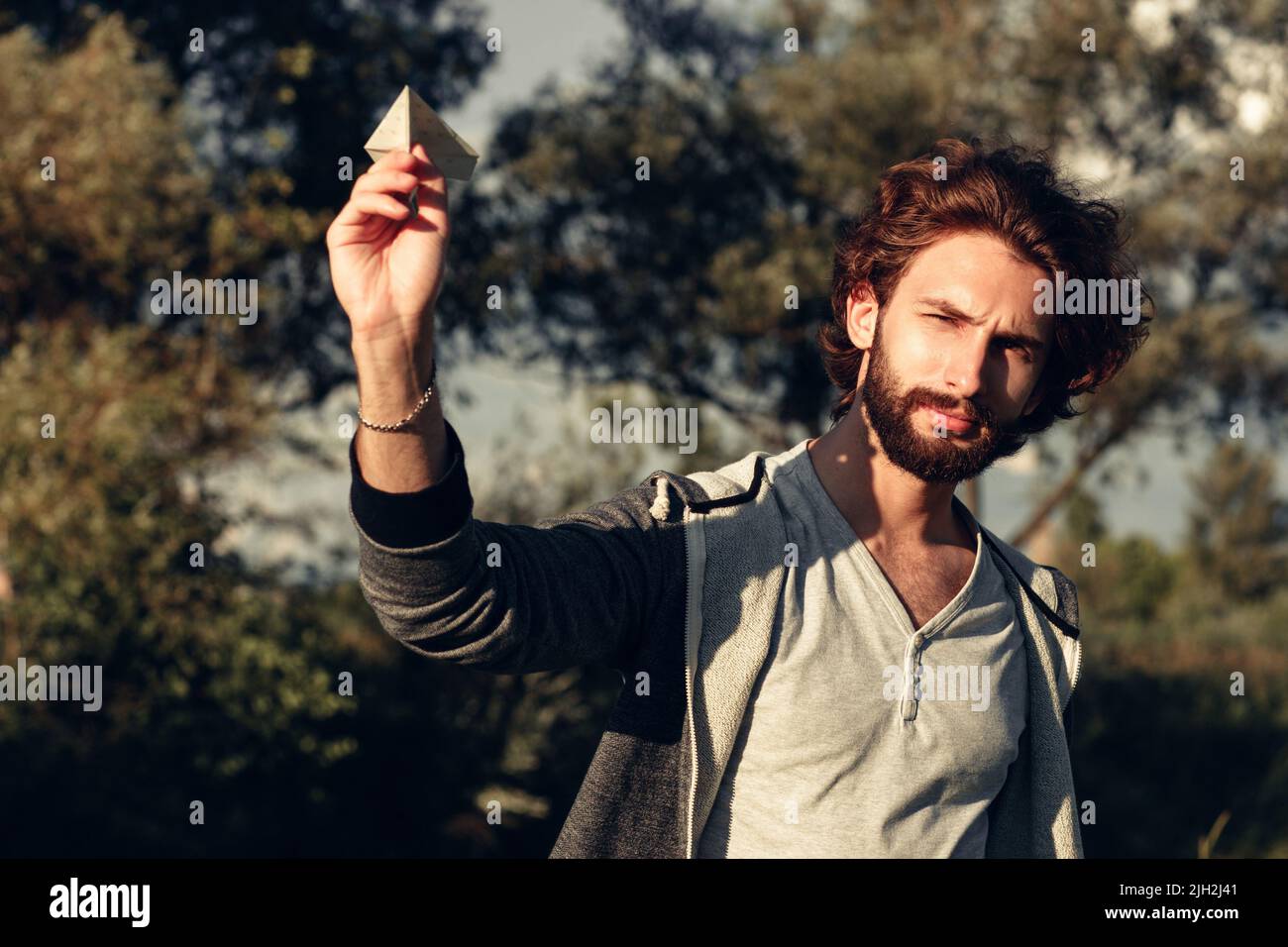 Adult playing with paper airplane hi-res stock photography and images ...