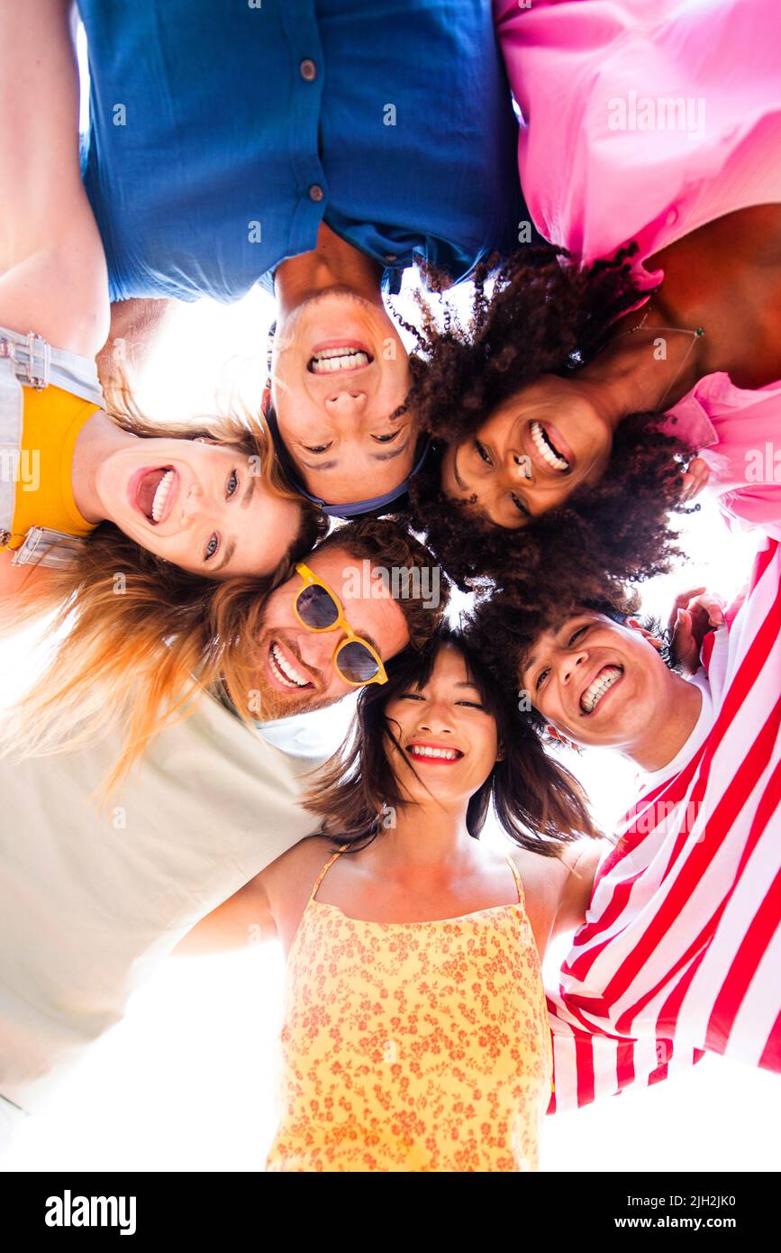 Multiethnic Group Of Young Happy Friends Bonding Outside Having Fun On