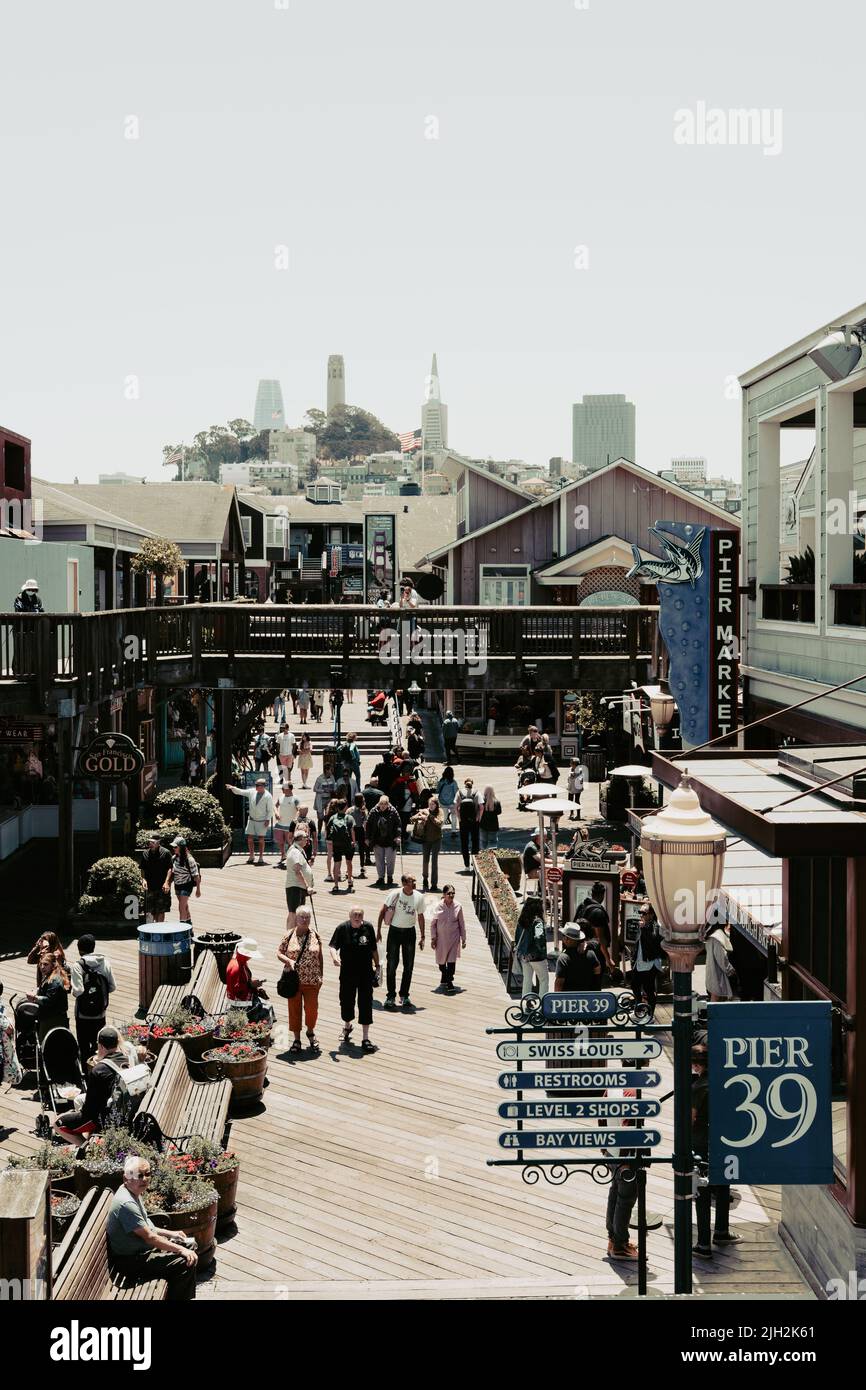 View of people exploring Pier 39, a shopping center and popular tourist ...