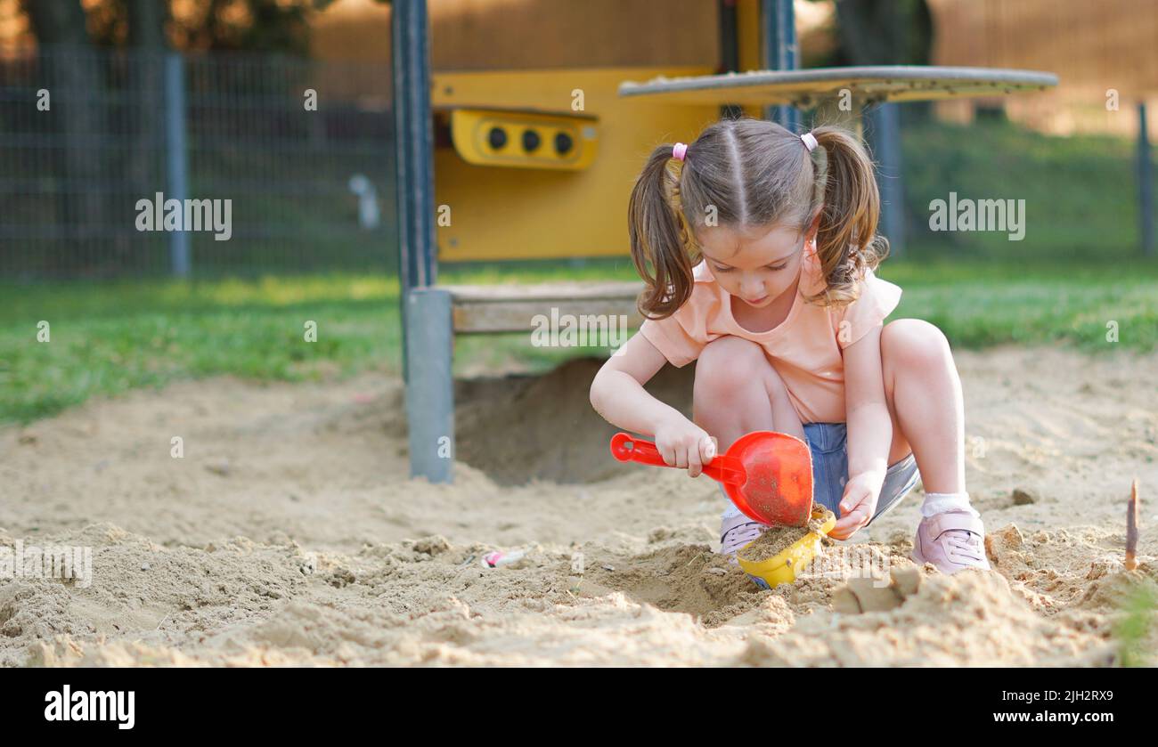 Kid having fun in sand hi-res stock photography and images - Alamy