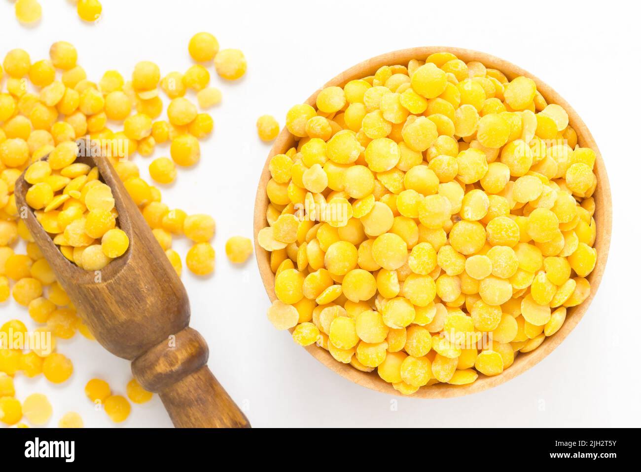 Yellow lentils in a wooden bowl. Wooden scoop Stock Photo - Alamy
