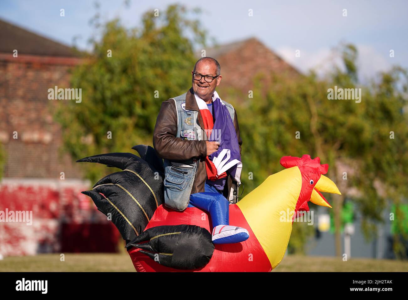 A France fan wearing a cockerel fancy dress outfit ahead of the UEFA ...