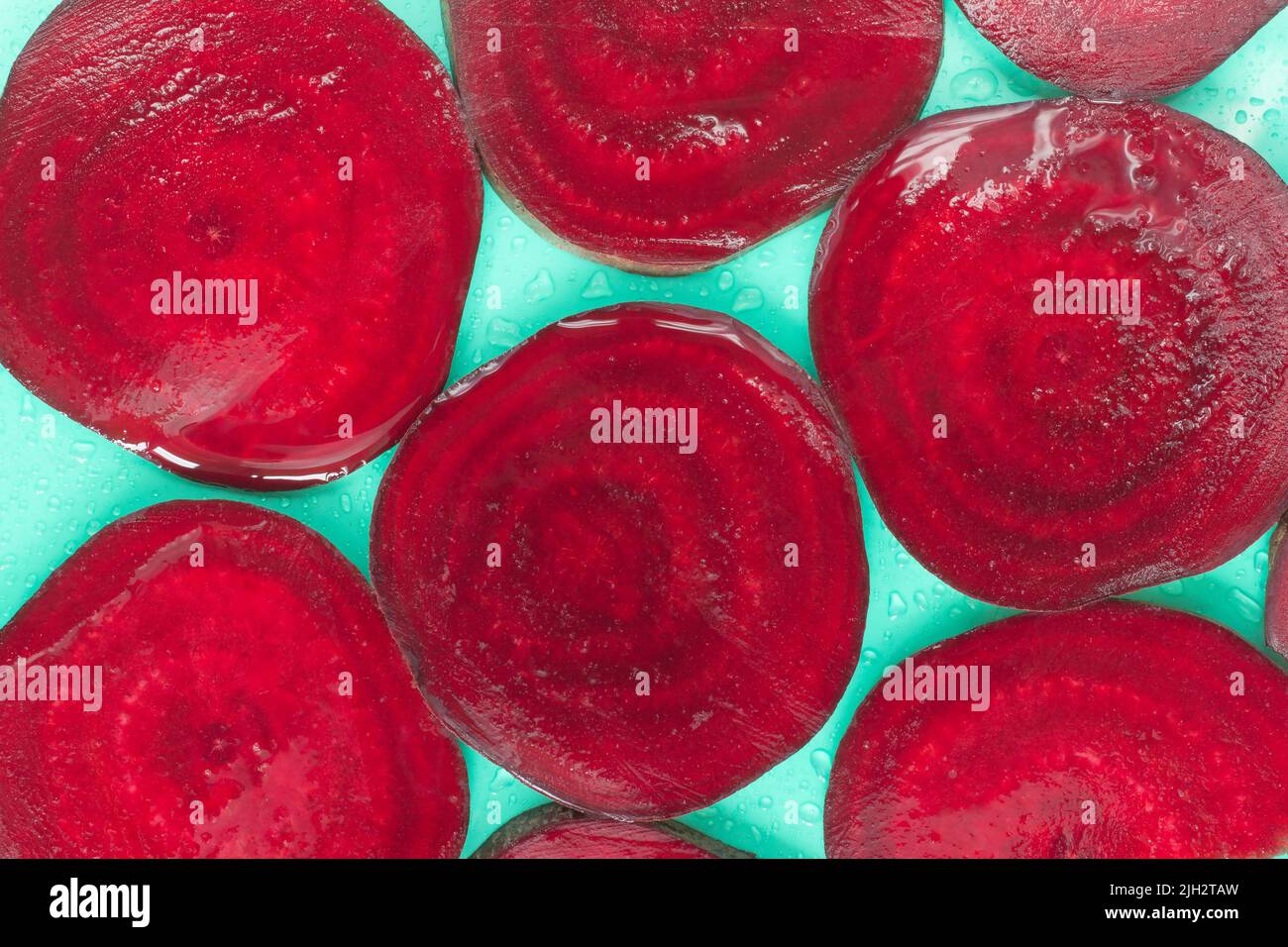 Beetroot. Cross section. Water drops. Green background. Top view Stock ...