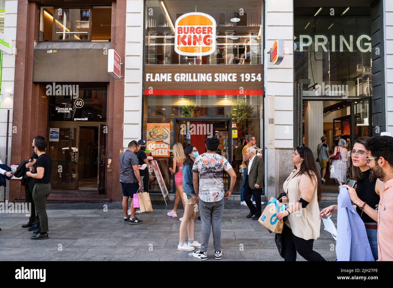 Madrid, Spain. 28th May, 2022. Pedestrians walk past the American chain ...