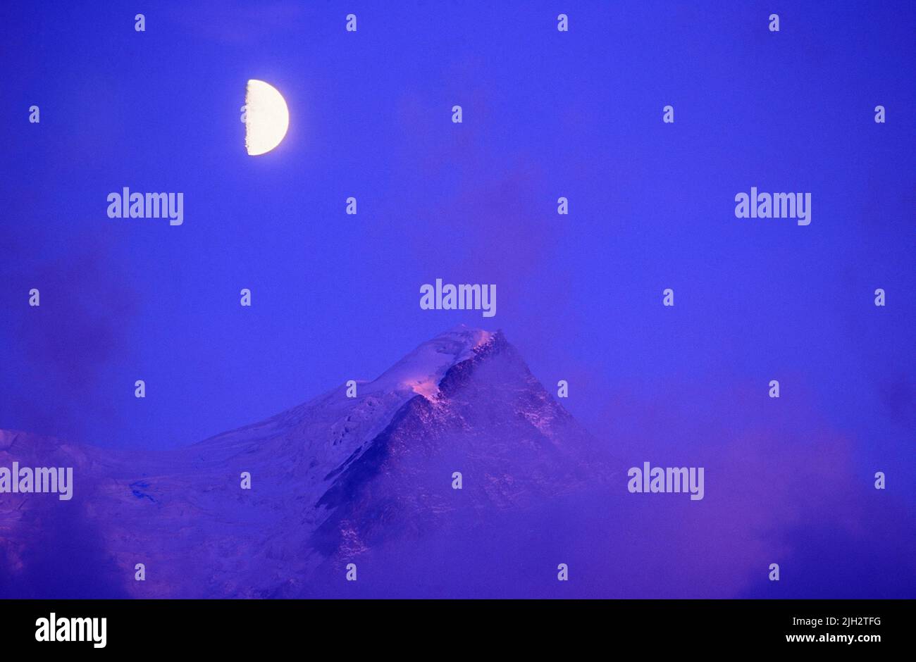 Aiguille du Goûter at dusk, Mont Blanc massif, Haute-Savoie, France. (c ...
