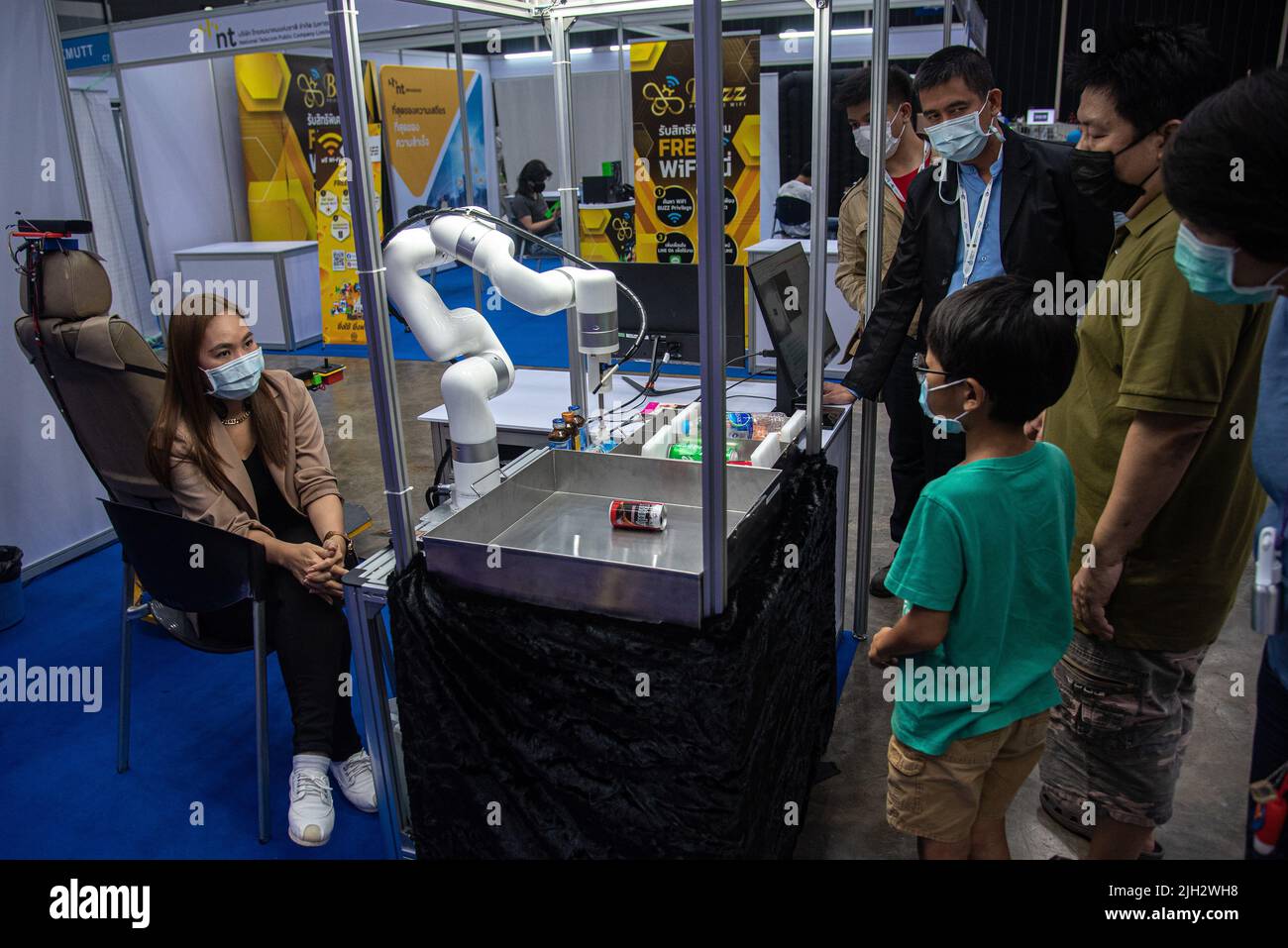 Bangkok, Thailand. 14th July, 2022. A kid interacts with a robot at the ...