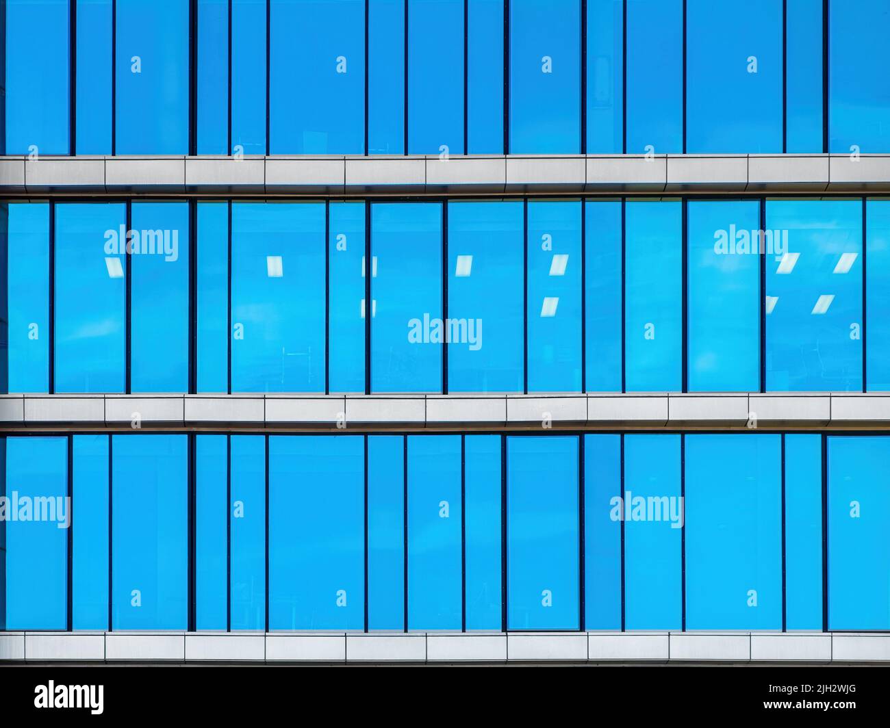 Glass facade of a modern building. Background image Stock Photo - Alamy