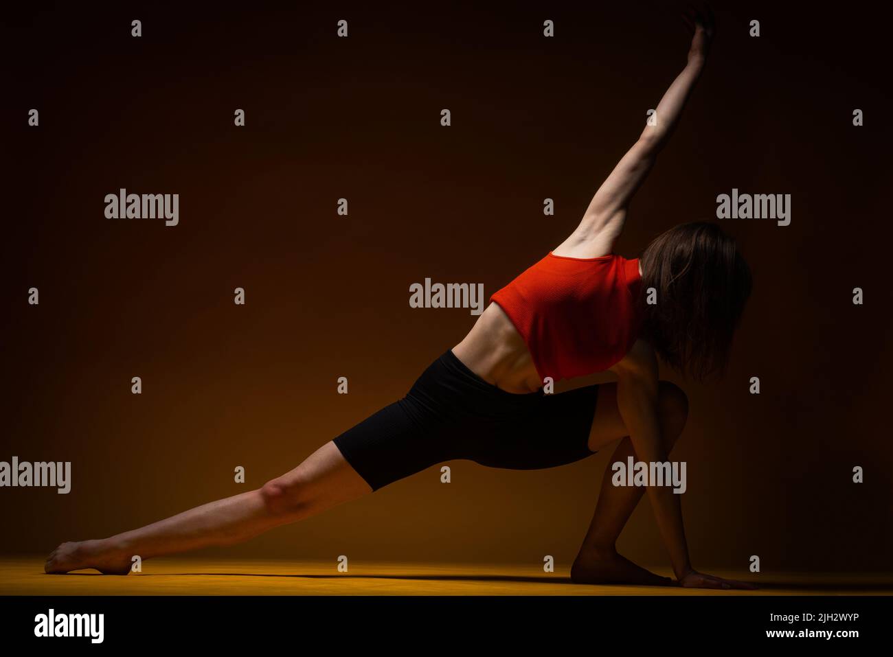 Ballerina is doing a perfect stretch pose on the ground Stock Photo - Alamy