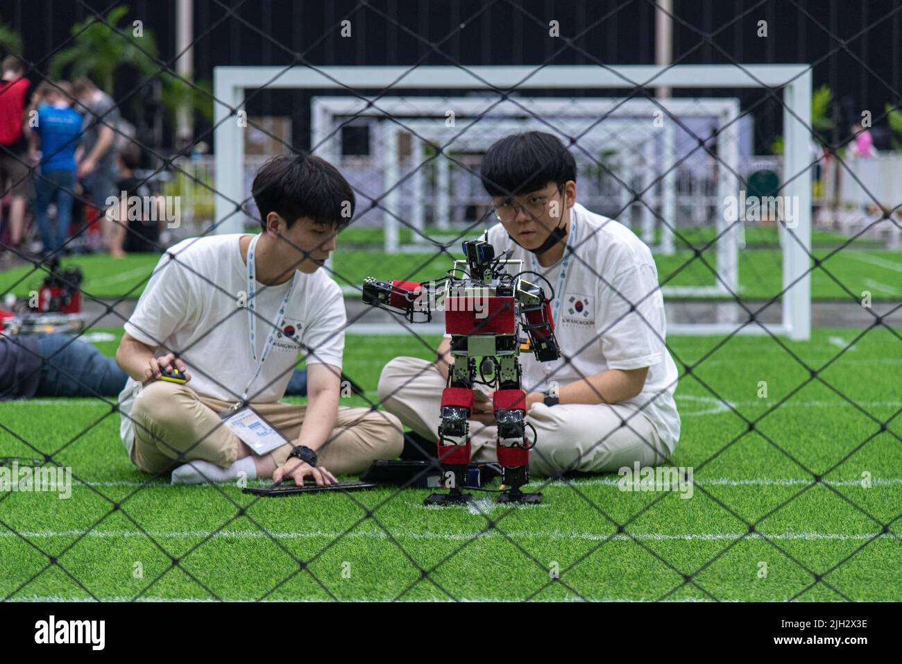Bangkok, Thailand. 14th July, 2022. Team members prepare their robots before a match at the ...
