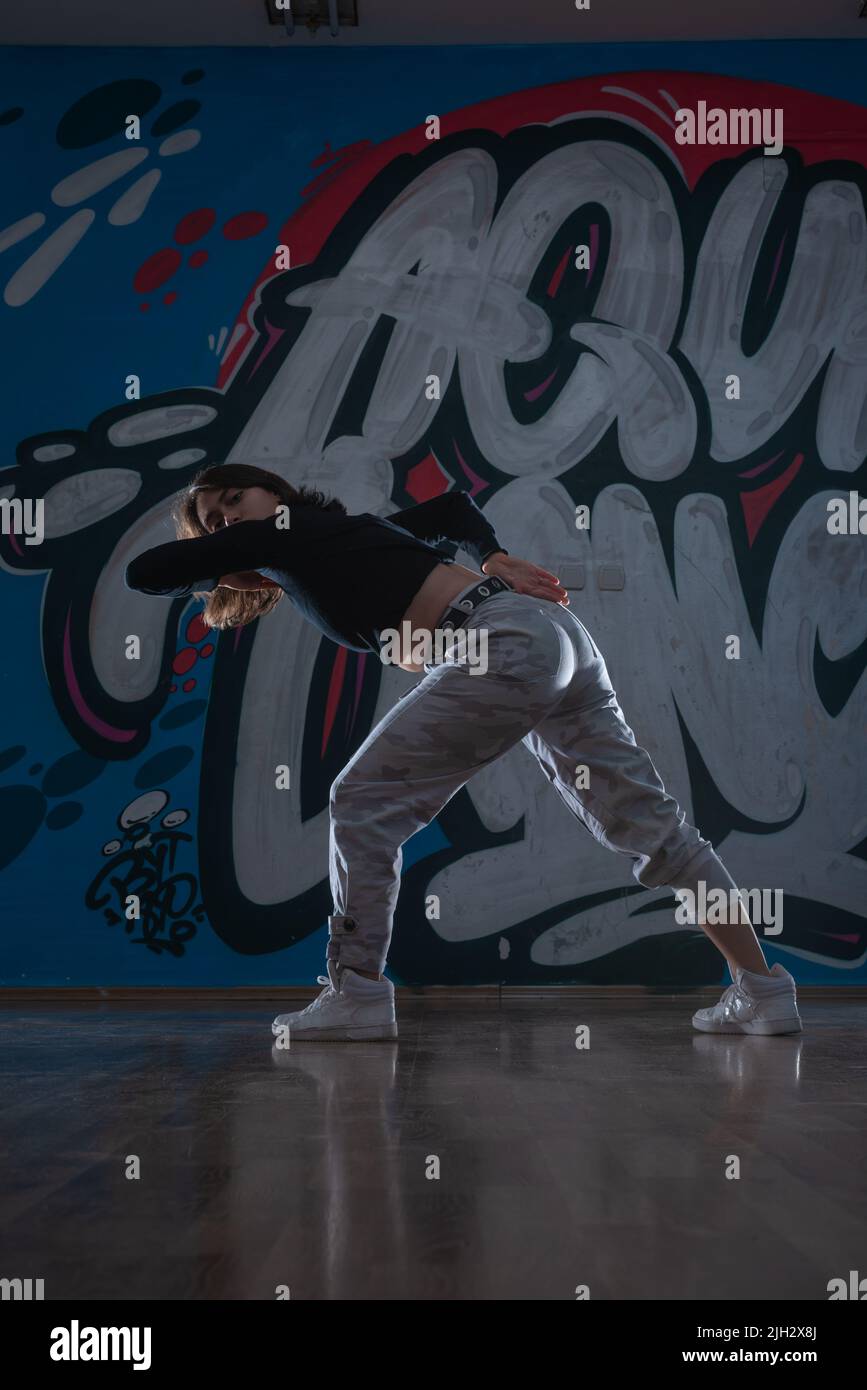 Silhouette of young woman hiphop dancer (breakdancer)dancing on ...