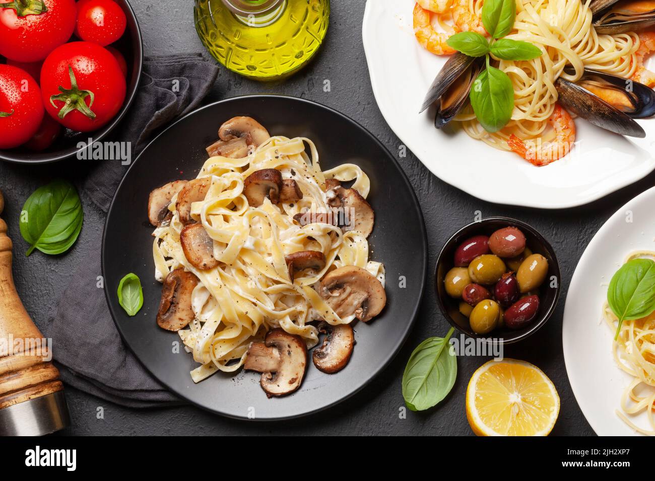 Various Italian pasta. Seafood, mushroom and tomato sauce pasta ...