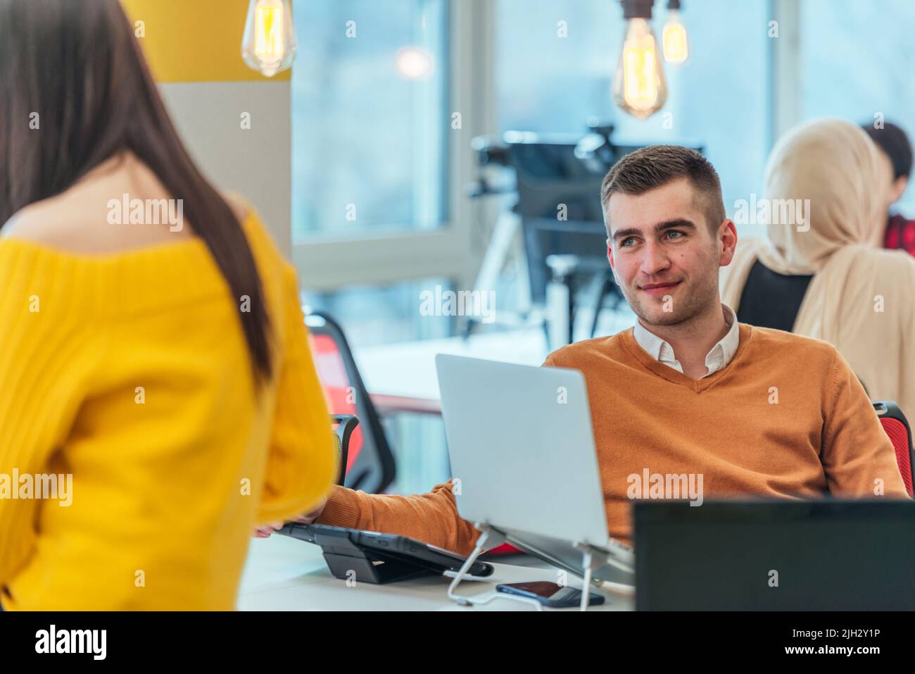 Team working on a digital project. Group of coworkers working in a ...