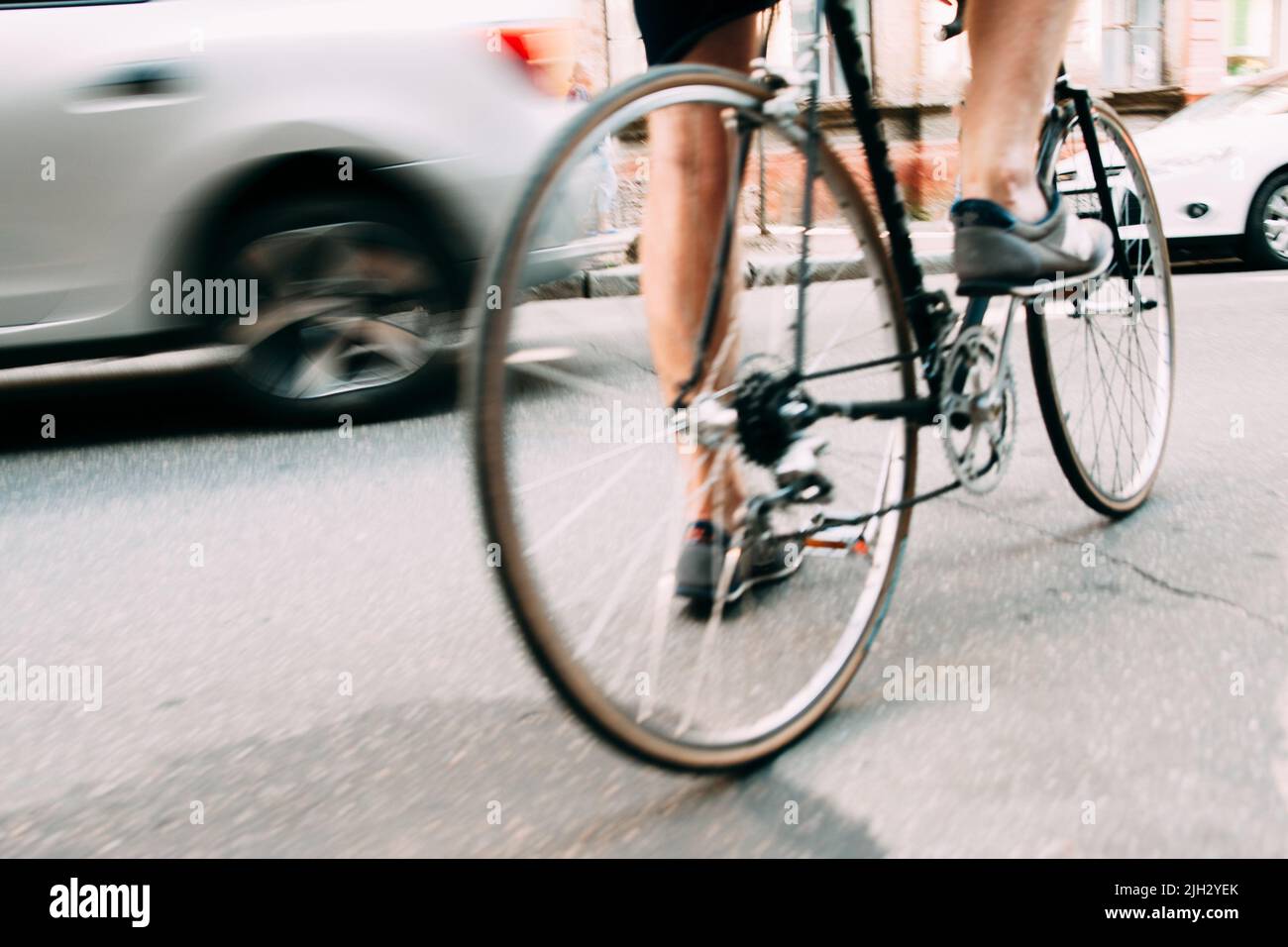 Man on bike with legs up hi-res stock photography and images - Alamy