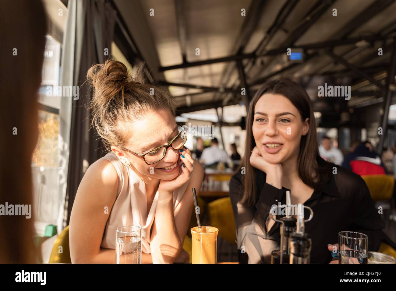 Two amazing and attractive businesswomen are laughing together Stock ...