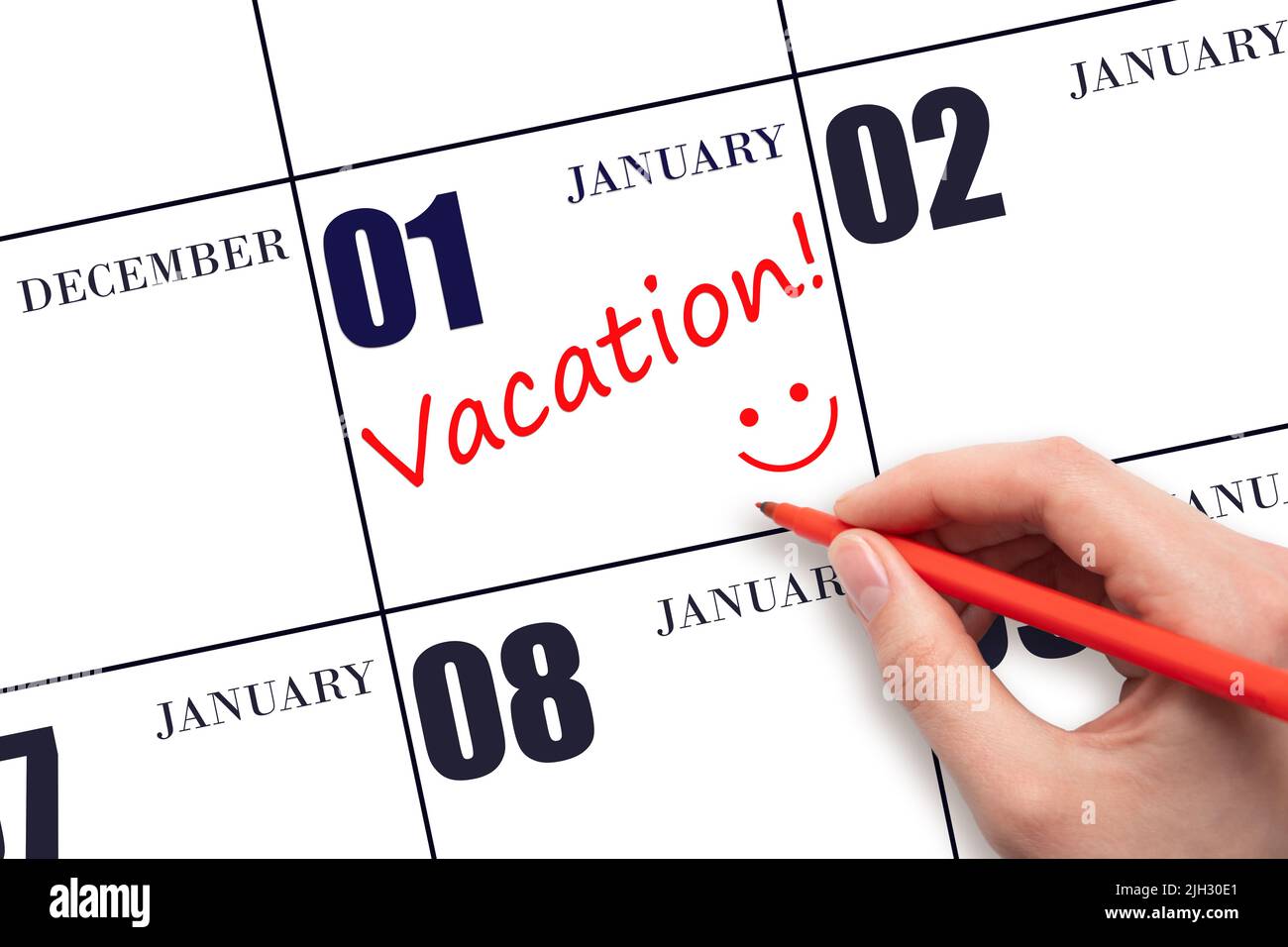 1st day of January. A hand writing a VACATION text and drawing a ...
