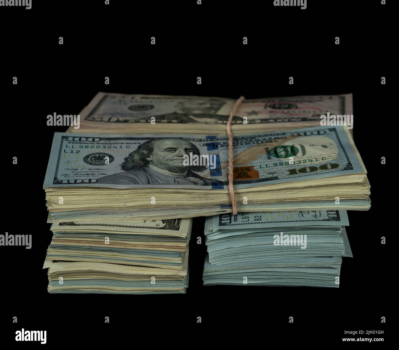 Stacks of 100 dollar bills hi-res stock photography and images - Alamy