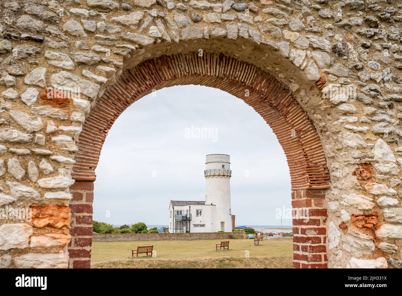 The ruins of St Edmunds Chapel frames the lighthouse at Hunstanton on ...
