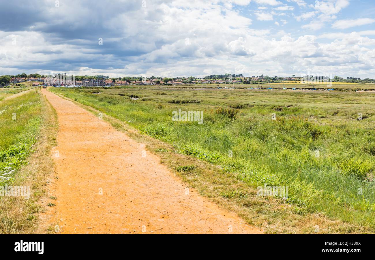 A multi image panorama of a raised pathway on the Norfolk Coastal path ...