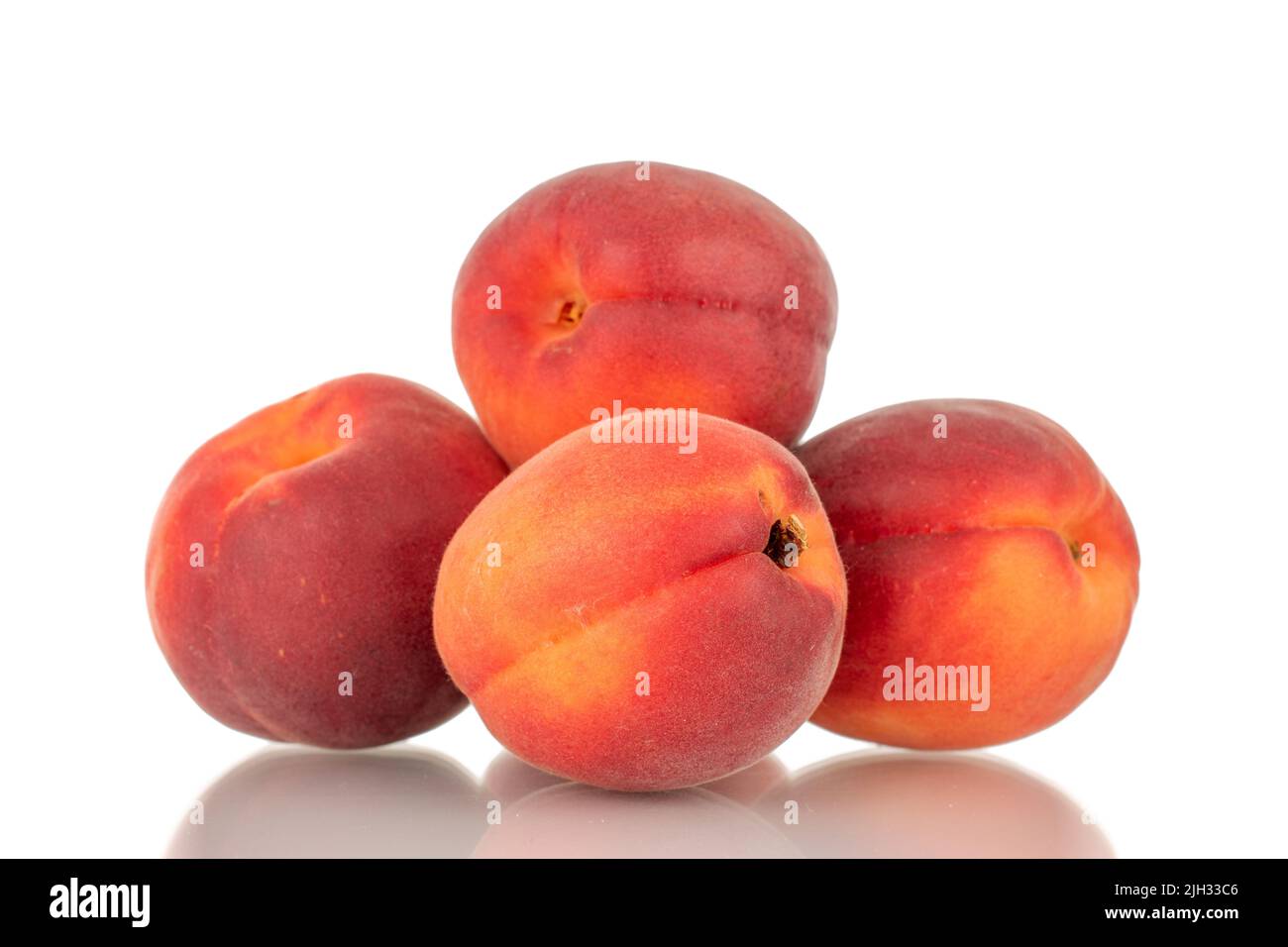 Several ripe red apricots, close-up, isolated on a white background ...