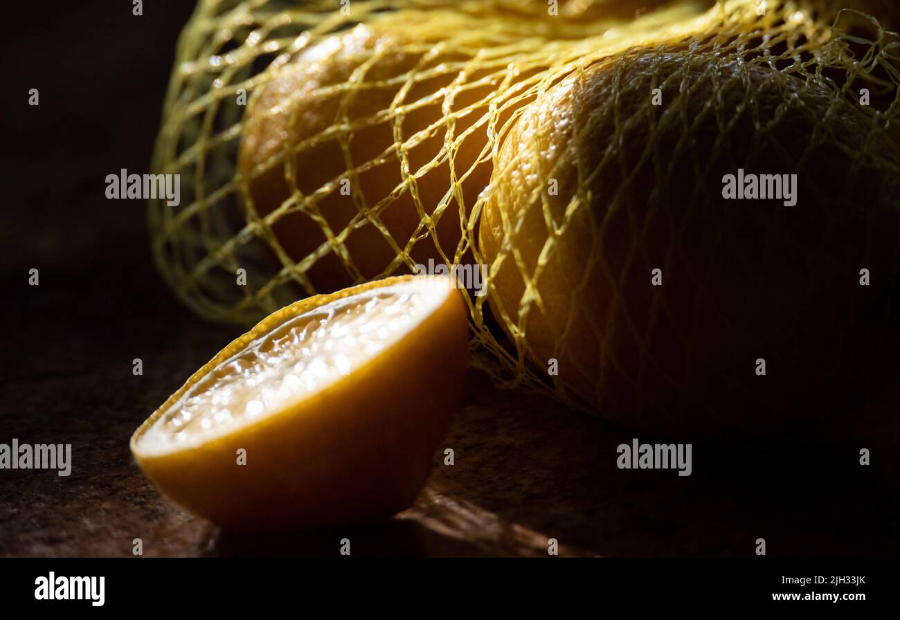 Lemons in the grid up close view. Fruit in the rays of the sun on a ...