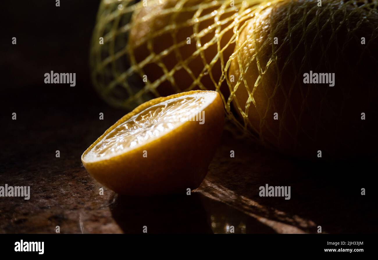 Lemons in the grid up close view. Fruit in the rays of the sun on a ...
