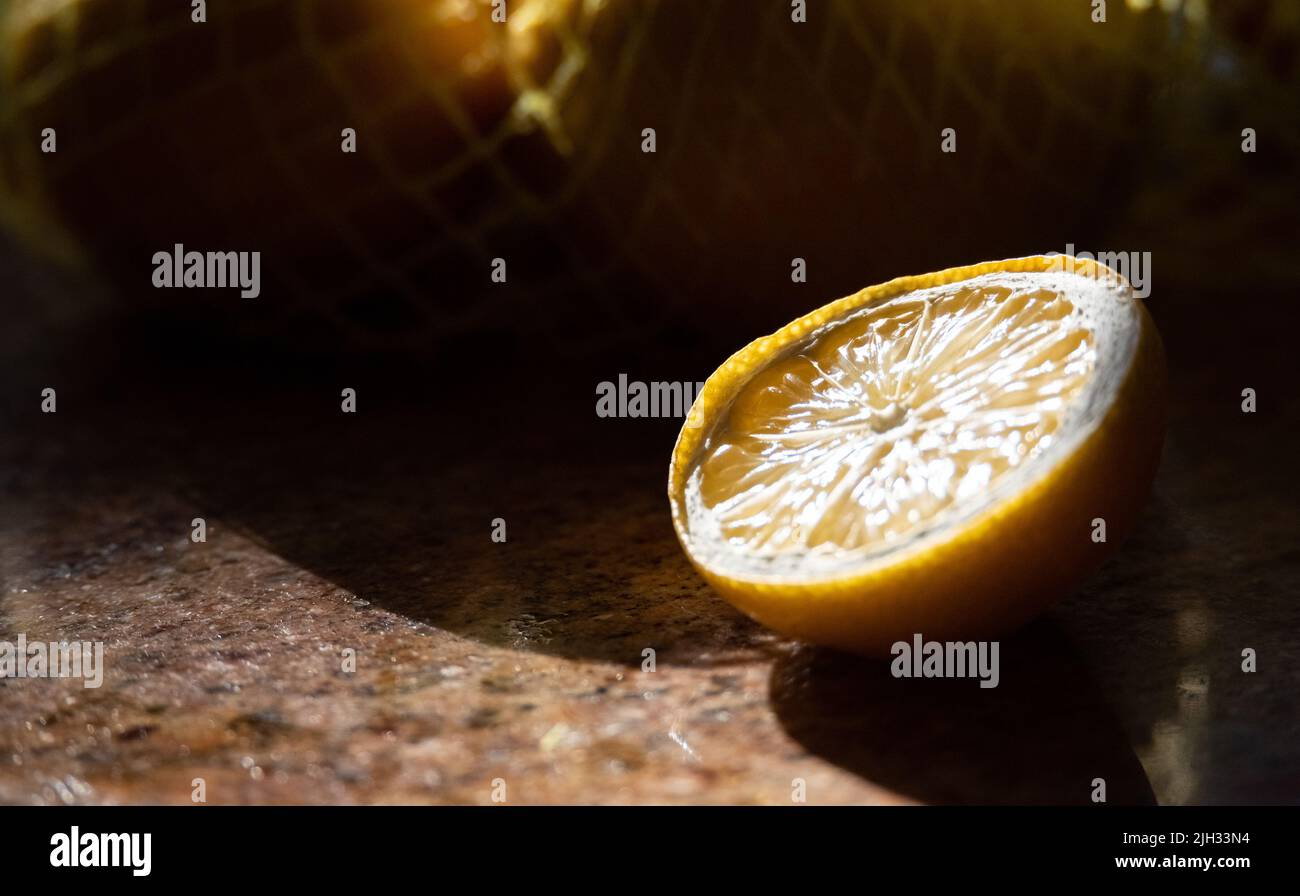 Lemons in the grid up close view. Fruit in the rays of the sun on a ...