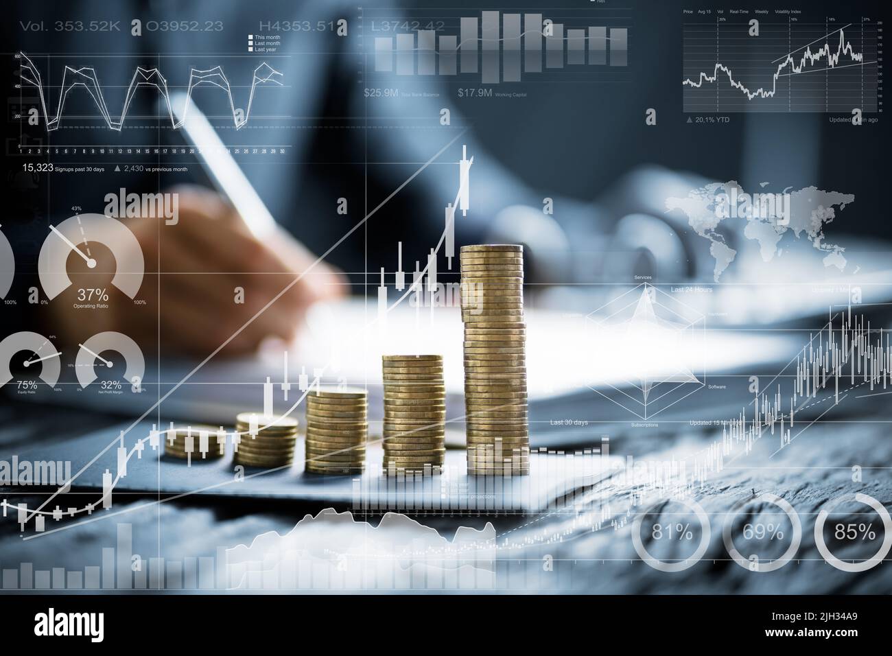 Midsection of businessman calculating invoice with stacked coins ...