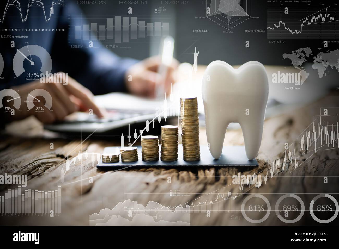 Close-up Of White Tooth Over Desk In Front Of Man Calculating Bill With ...