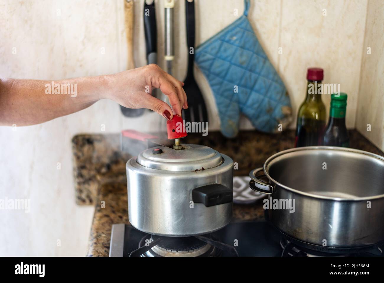 Woman cooking pot cleaning hi-res stock photography and images - Alamy