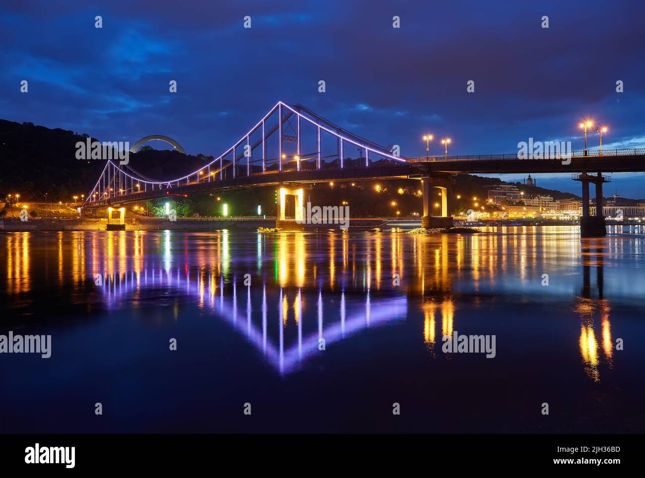 Night city minimal landscape. Pedestrian bridge across the Dnieper ...