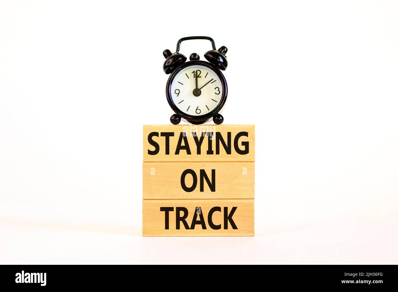 Staying on track symbol. Concept words Staying on track on wooden ...