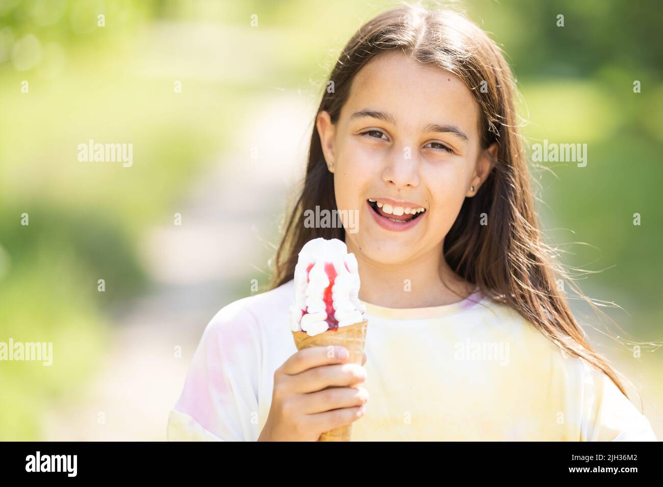 Cute Girl Eating Ice Cream Stock Photo - Alamy