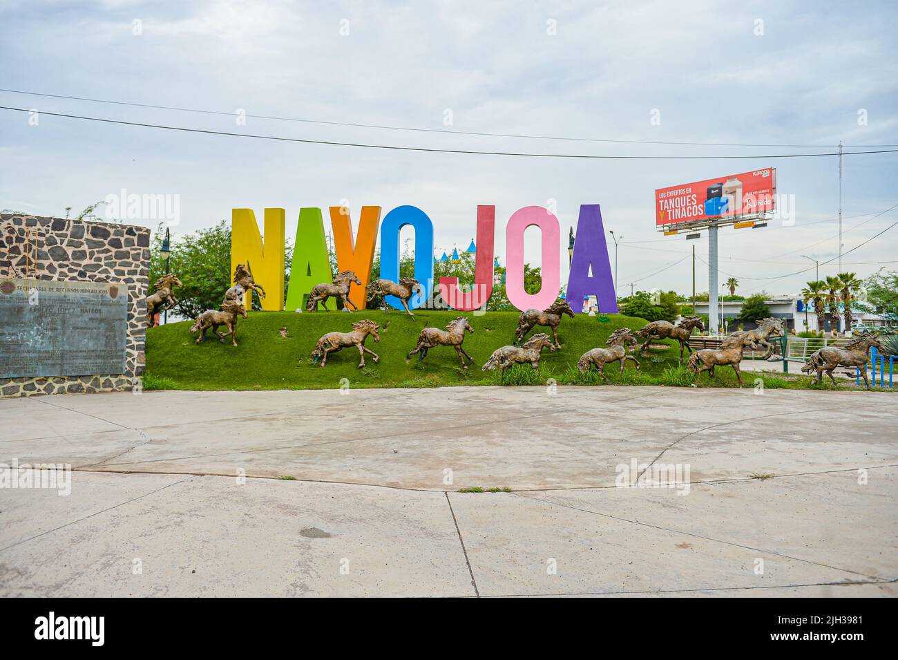 Monumental colored letters and horse stampede sculpture at the entrance ...