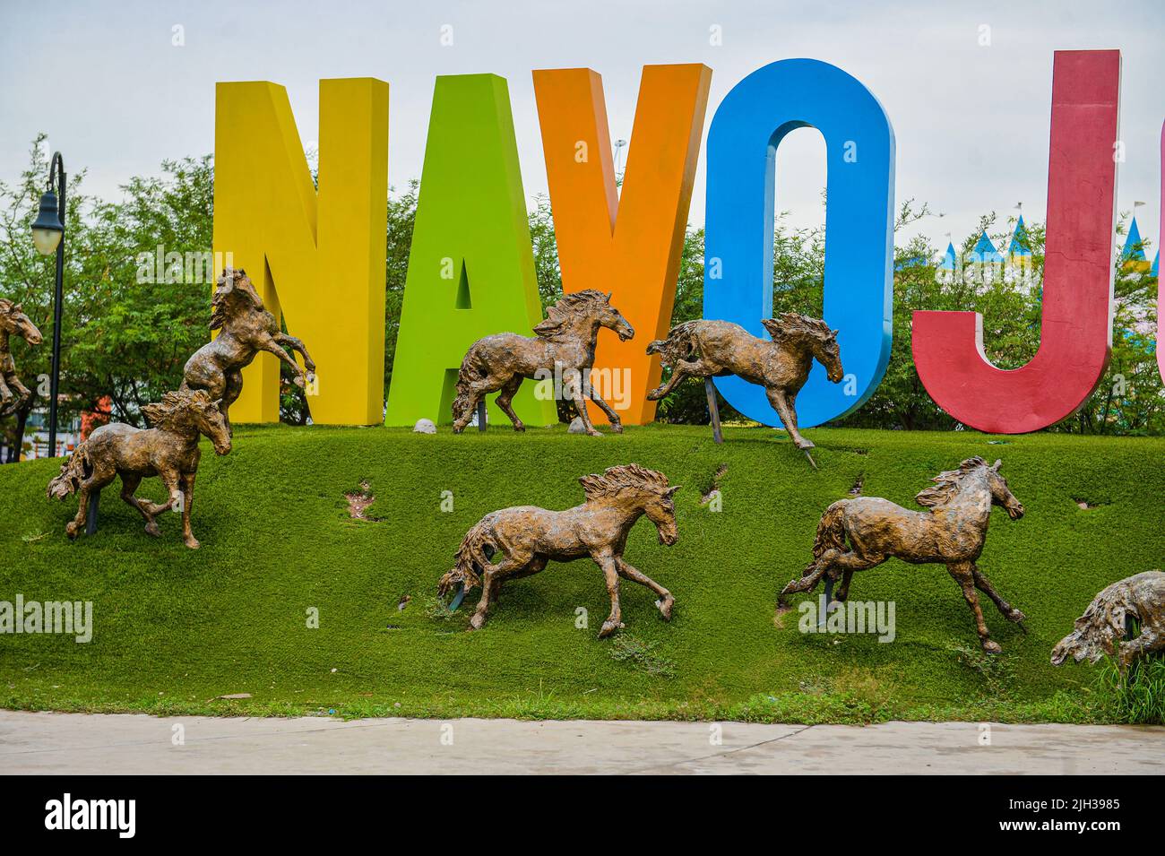 Monumental colored letters and horse stampede sculpture at the entrance ...