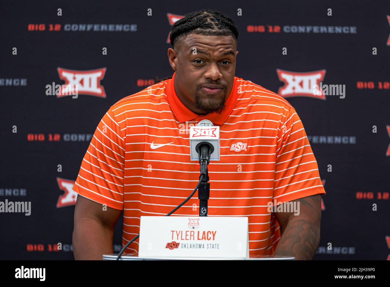 Oklahoma State Cowboys defensive lineman Tyler Lacy speaks during Big ...